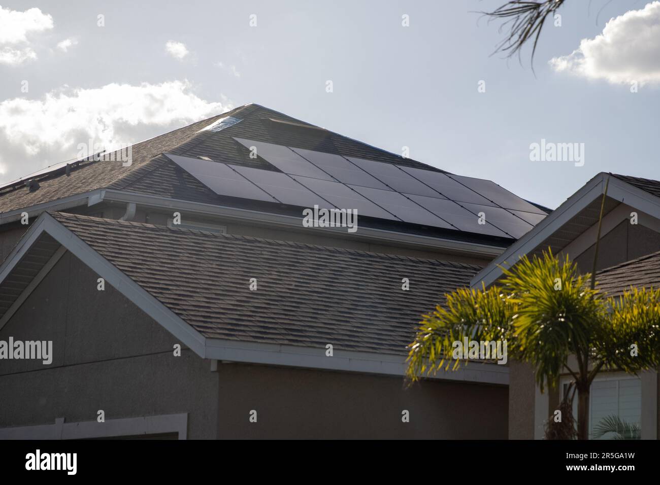 Home with Solar Panels attached to a roof Stock Photo - Alamy