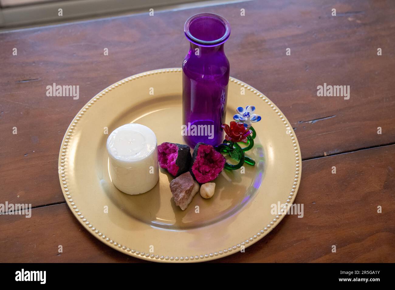 Simple spa set up with geodes and a candle Stock Photo - Alamy