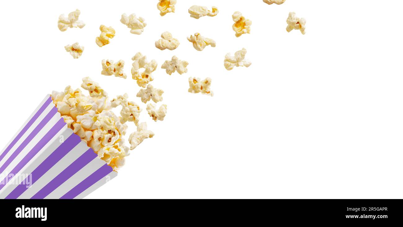 Popcorn flying out of purple white striped paper box isolated on white ...
