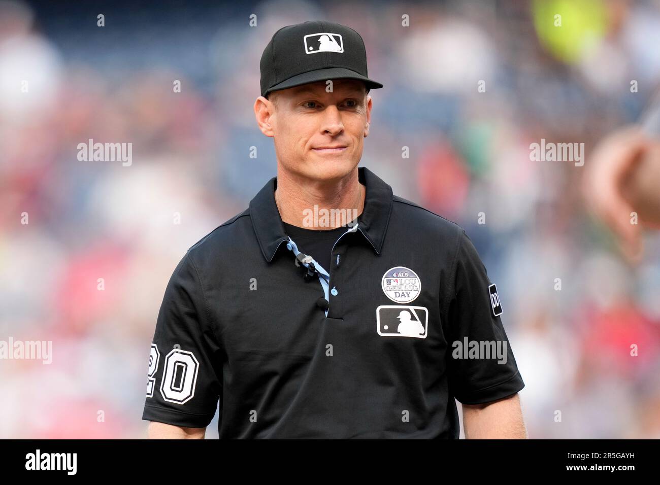 Umpire Brian Walsh walks on the field during a baseball game between ...