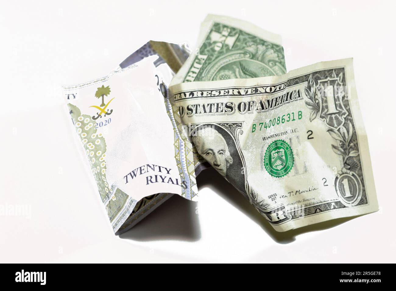 Wrinkled and crumpled Saudi Arabia money of 20 SAR twenty riyals and 1 ...