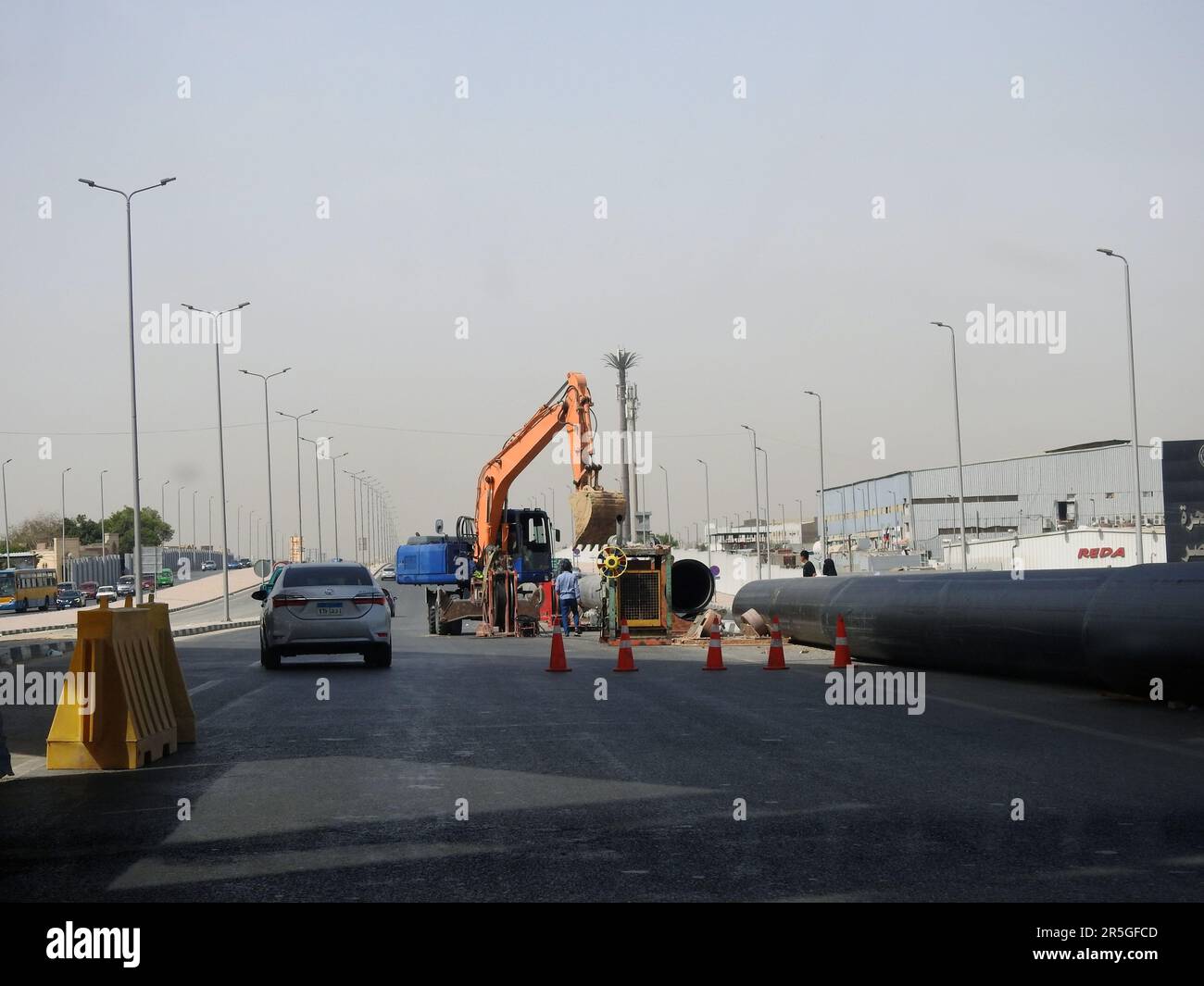 Cairo, Egypt, May 21 2023: preparations to place large water pipe parts ...