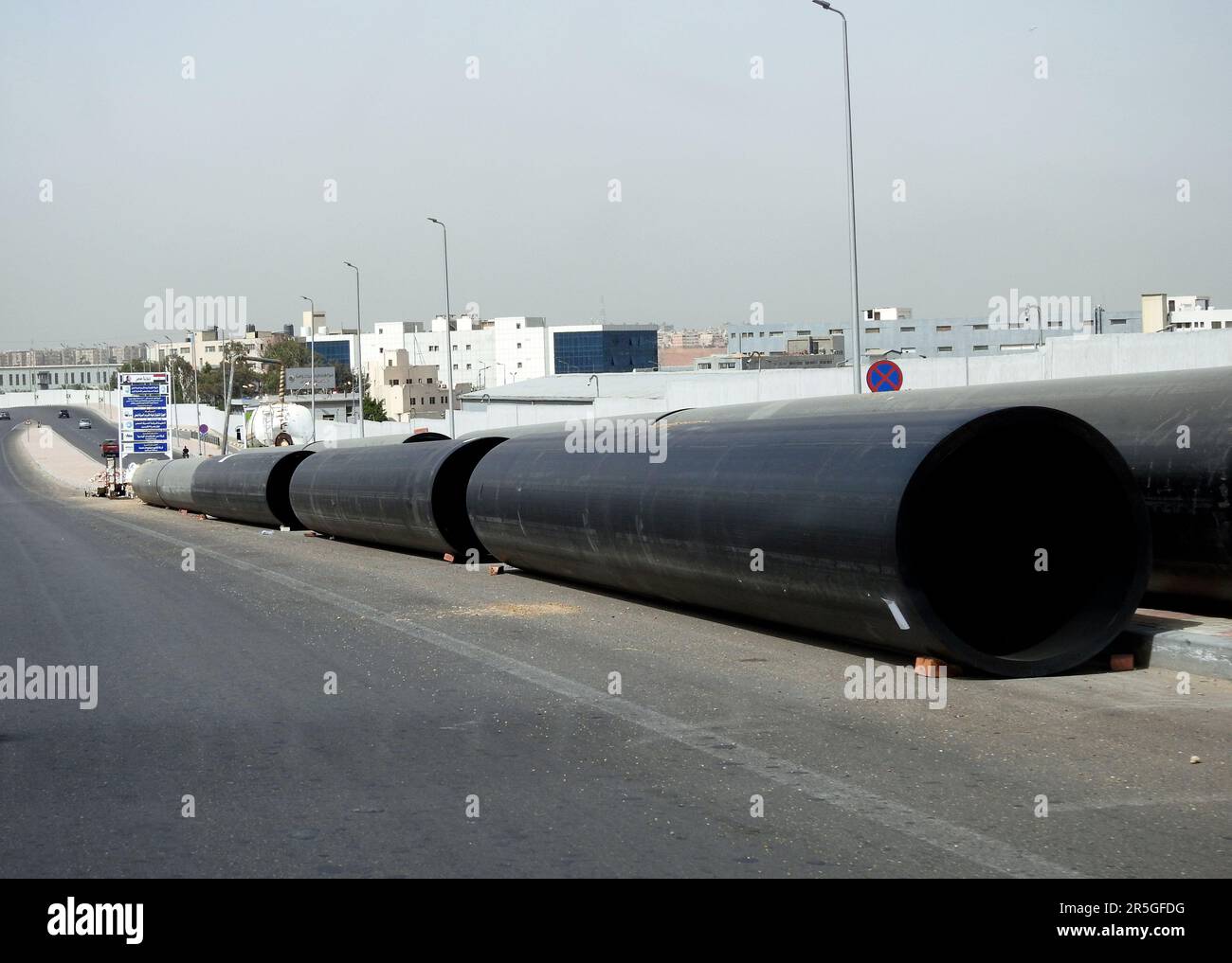 Cairo, Egypt, May 21 2023: preparations to place large water pipe parts ...