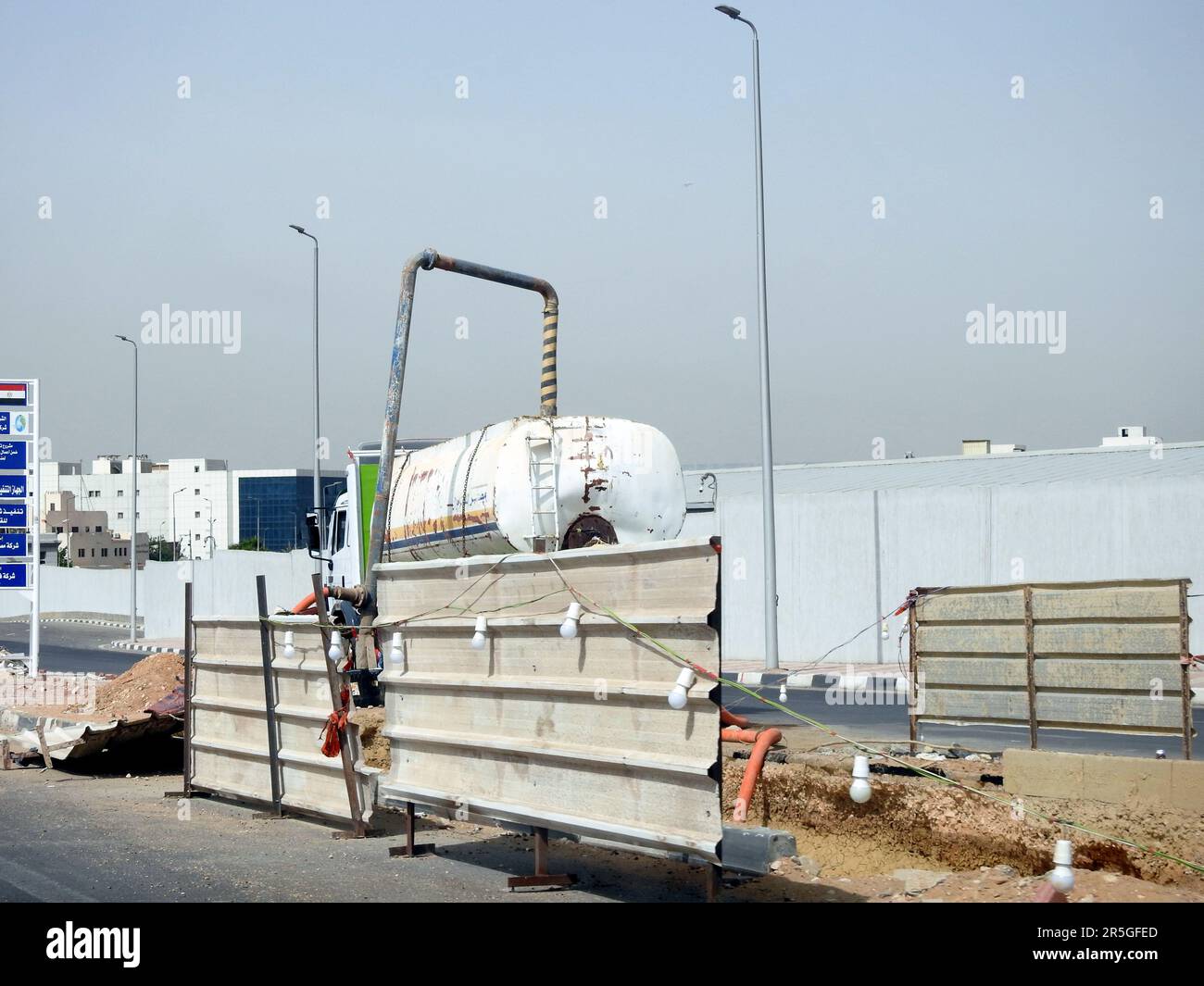 Cairo, Egypt, May 21 2023: preparations to place large water pipe parts ...