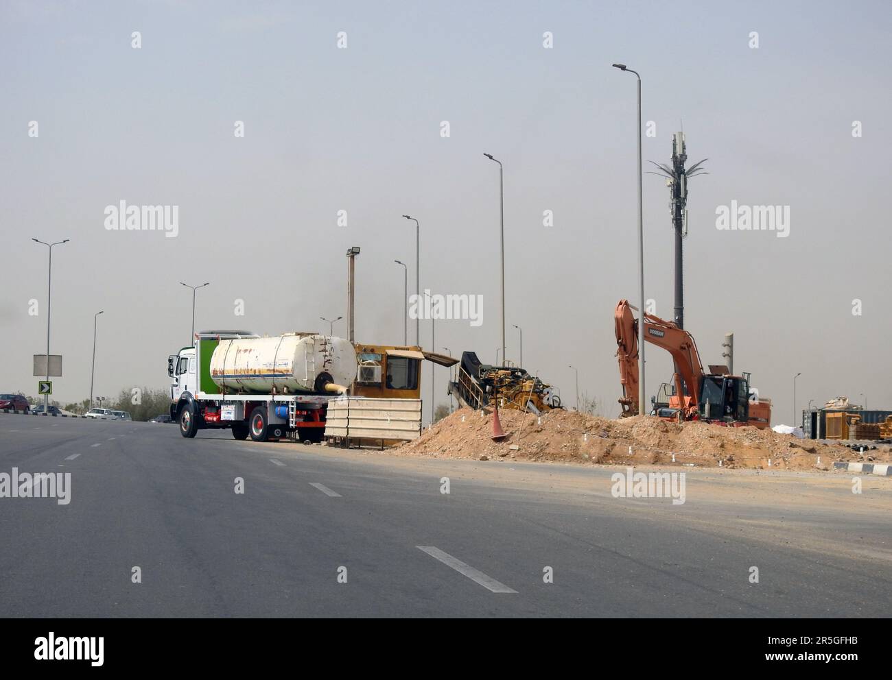 Cairo, Egypt, May 21 2023: preparations to place large water pipe parts ...
