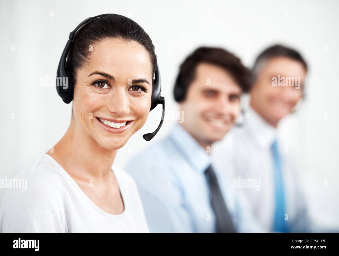 Let us help you...Positive customer service agents at work while wearing headsets Stock Photo ...