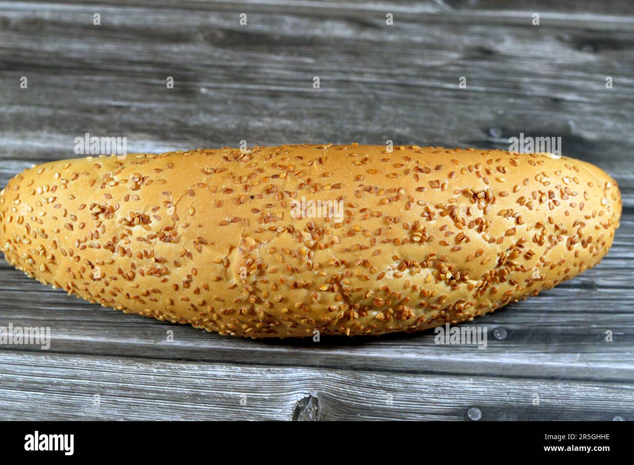 Long sesame bun bread, a fresh baked loaf of bread French Fino ready to ...