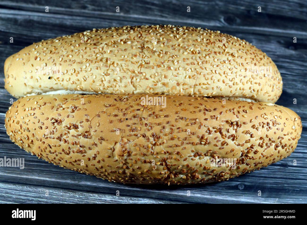 Long sesame bun bread, a fresh baked loaf of bread French Fino ready to ...