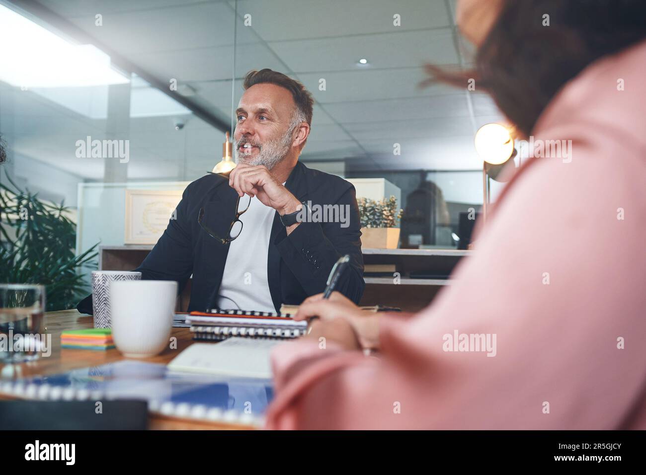 Teamwork gets the task done. a team of businesspeople having a meeting ...