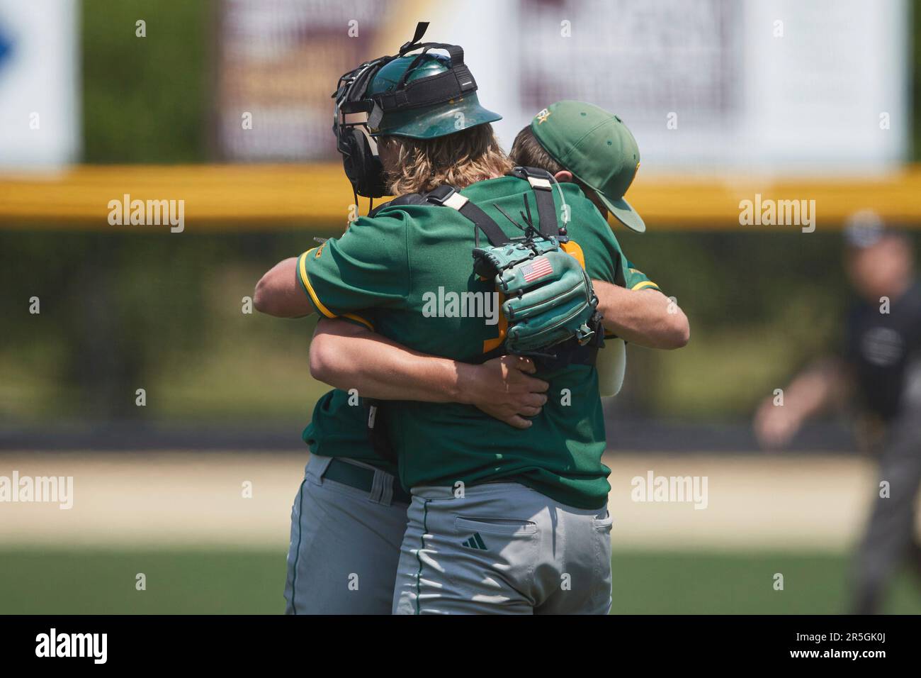 George Mason Patriots starting pitcher Chad Gartland (21) hugs catcher ...