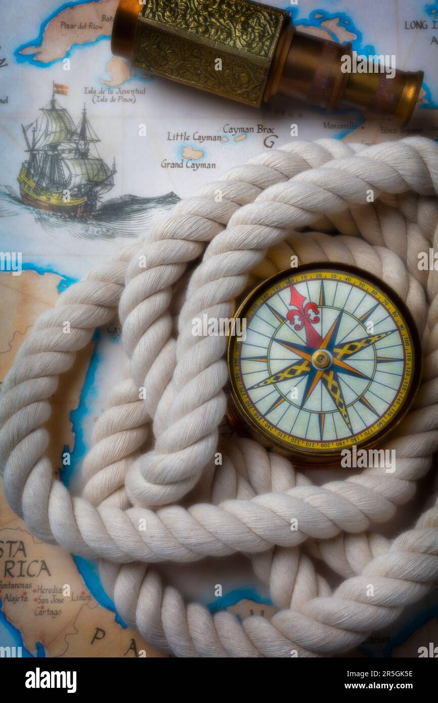 Old Compass In Rope On Map Still Life Stock Photo - Alamy