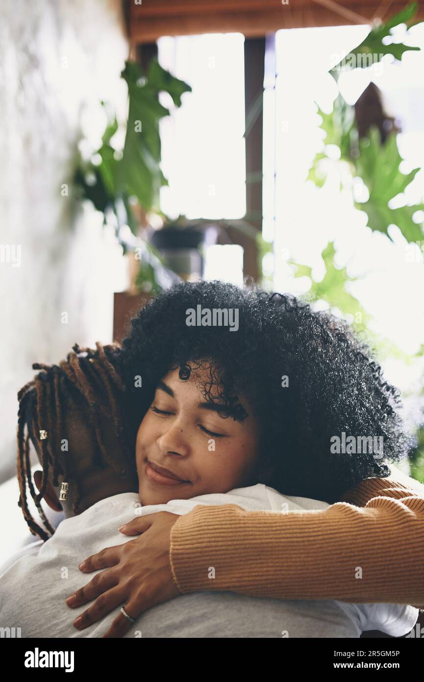 Thank you for always being by my side. a young woman hugging her boyfriend at home Stock Photo ...