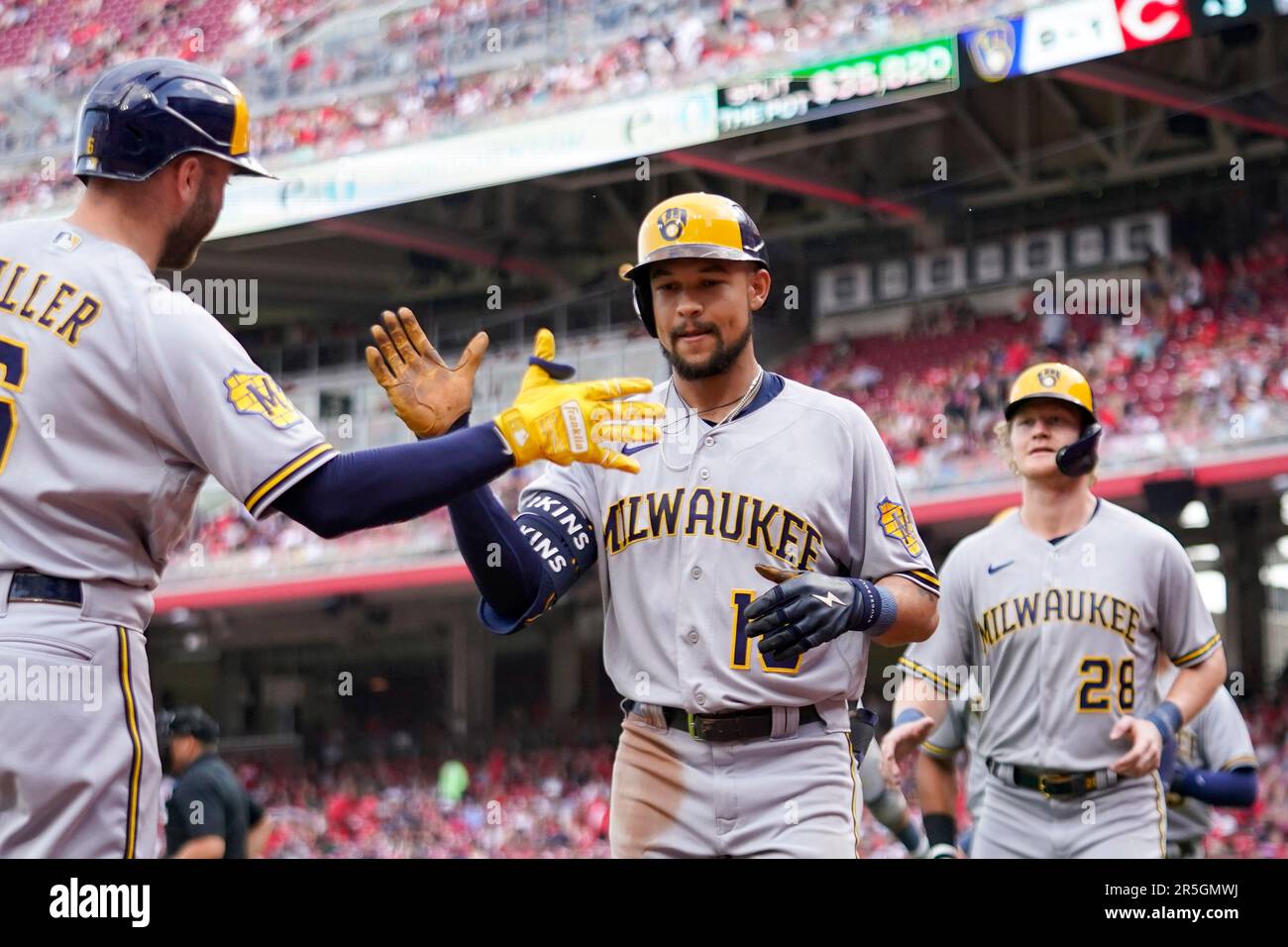 Milwaukee Brewers' Blake Perkins, center, celebrates with Owen Miller ...