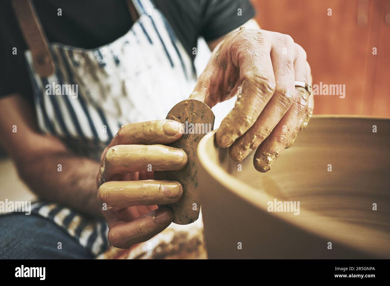 Do something creative everyday. an unrecognisable man working with clay ...