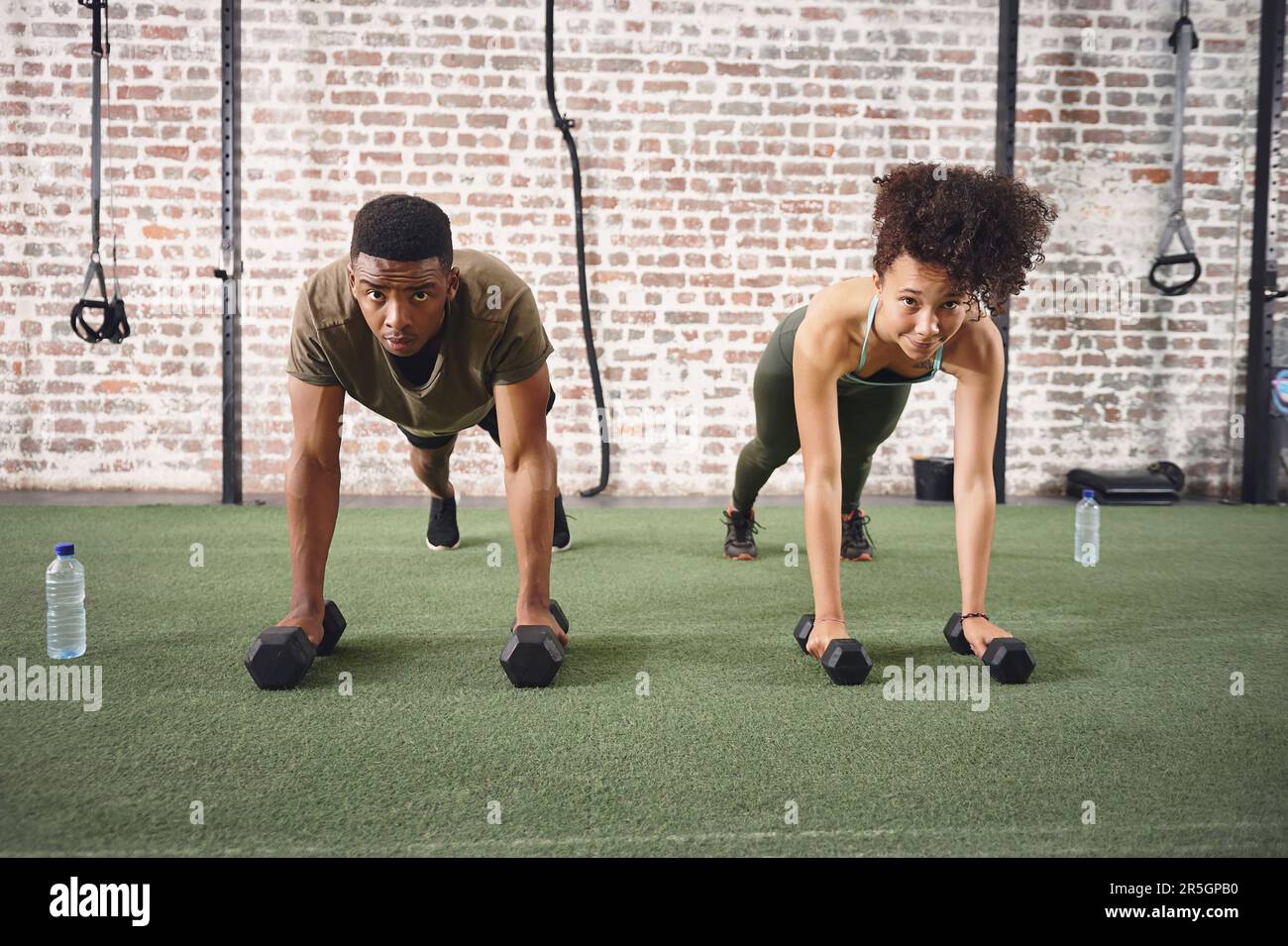 Want stronger arms Theres a workout for that. two sporty young people ...