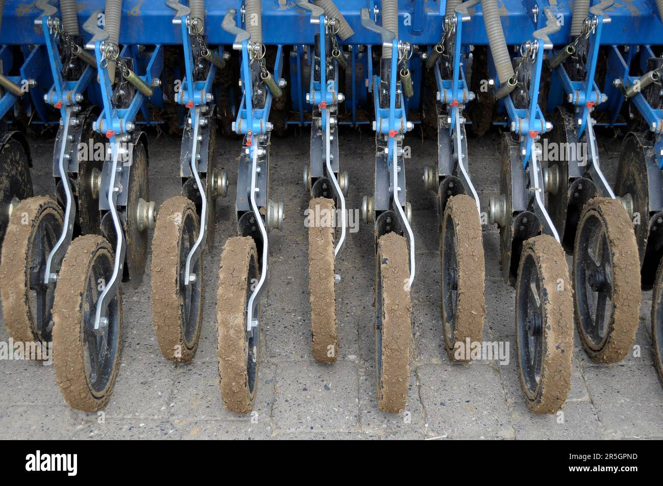 Agriculture: Wheels of a seed drill Stock Photo - Alamy