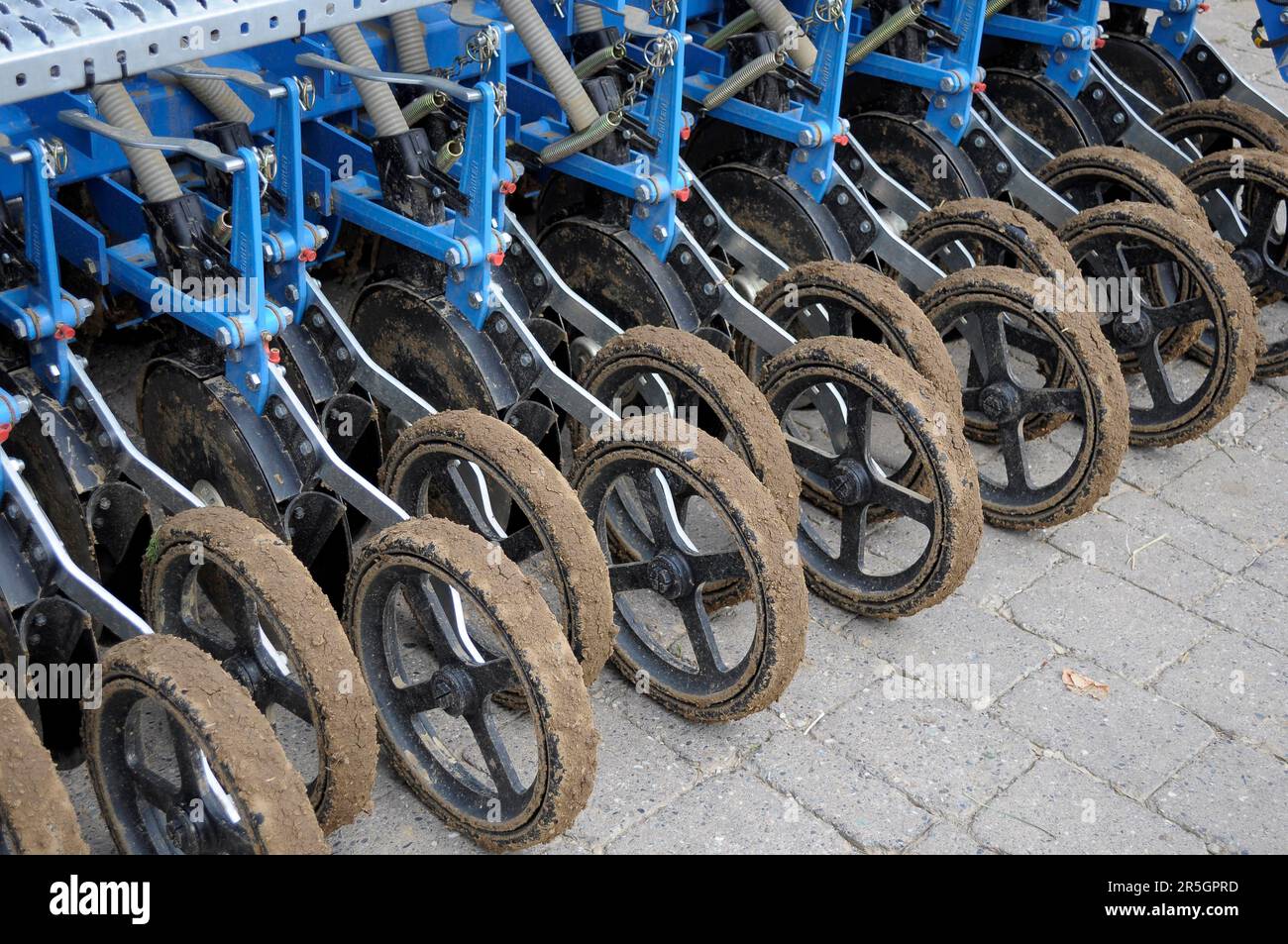 Agriculture: Wheels of a seed drill Stock Photo - Alamy