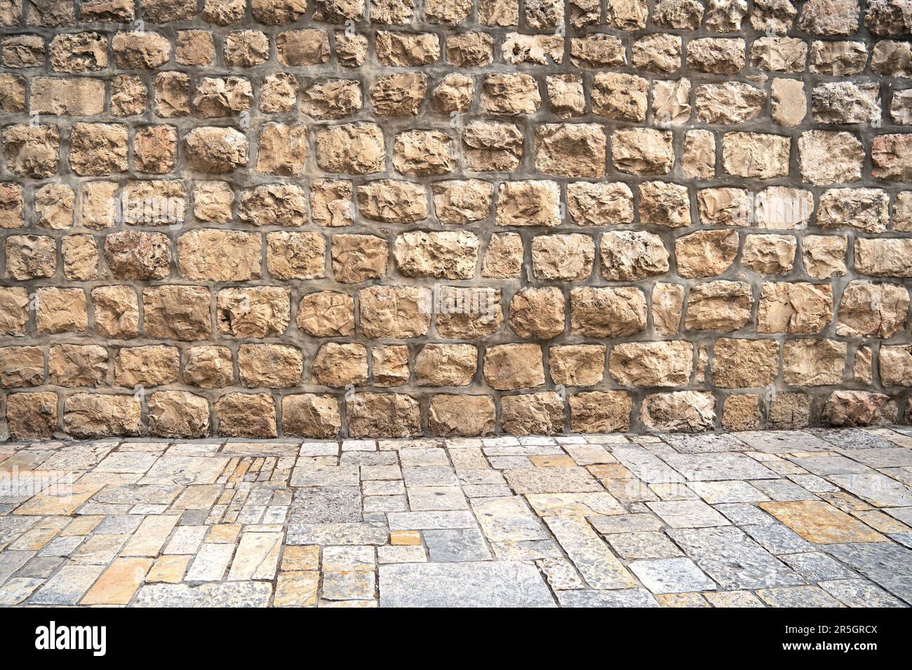 Ancient brick wall and pavement of old city of Jerusalem, Israel Stock ...