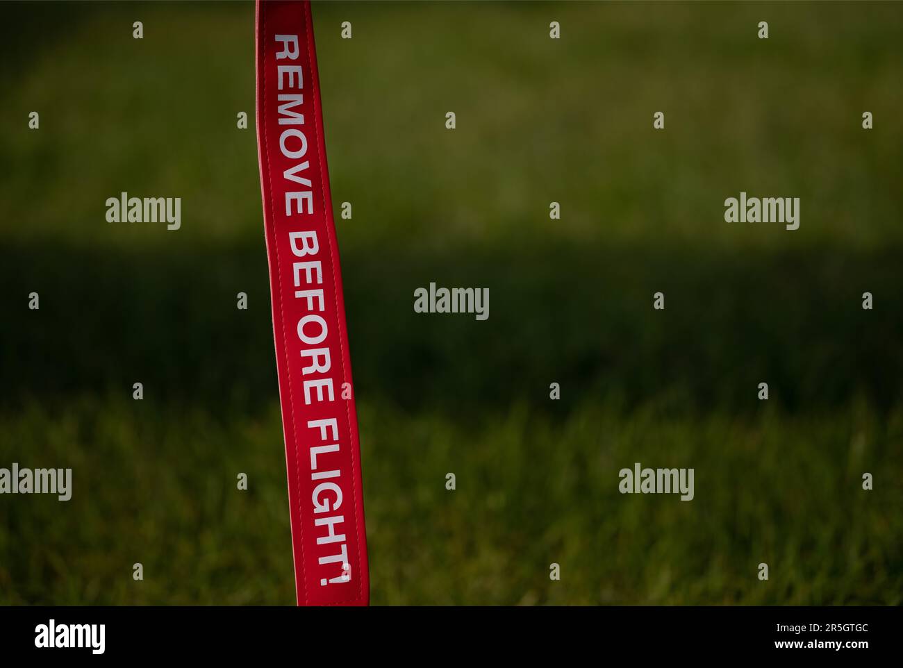 Airplane sign remove before flight Stock Photo - Alamy