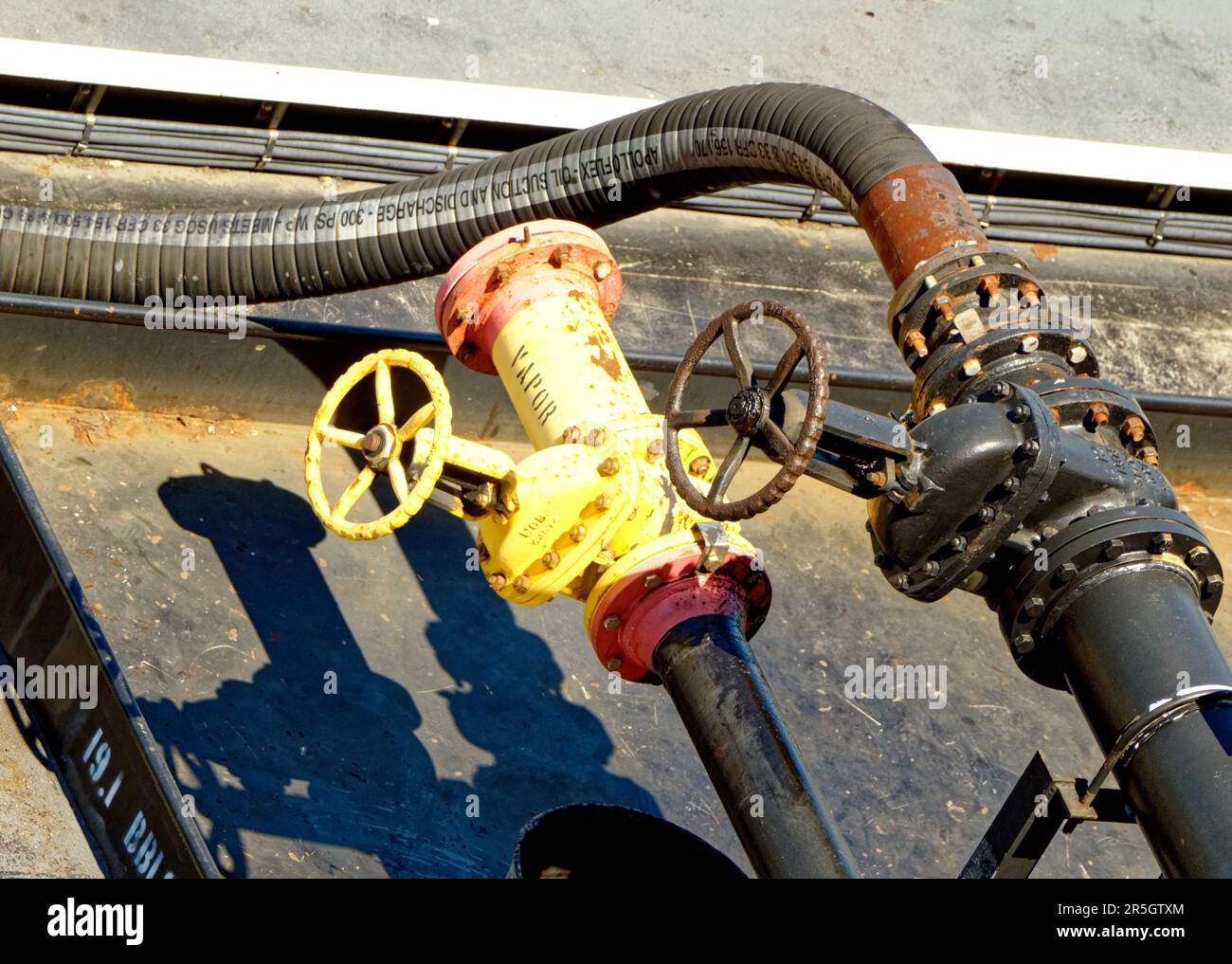 Black and Yellow Pipes and Valves on Refueling Barge Stock Photo - Alamy