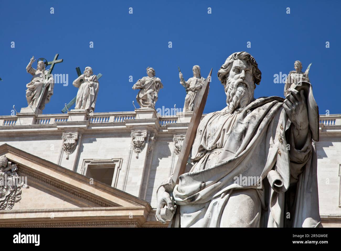 Statues in St. Peter Square (Rome) (Italy) with blue sky background ...
