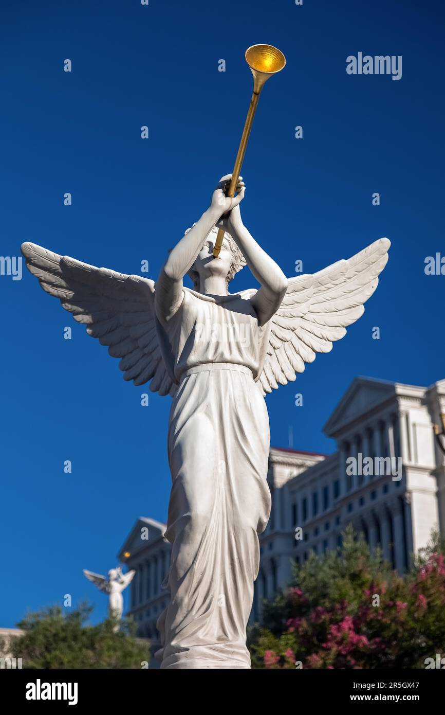 Angel Playing a Golden Bugle Stock Photo - Alamy