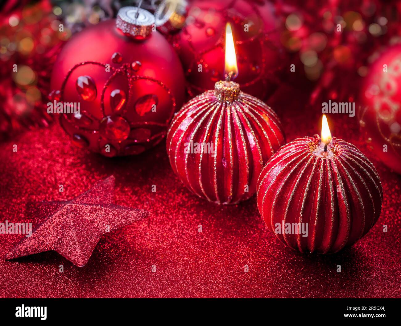 Christmas candles in red tone with glittering background Stock Photo ...