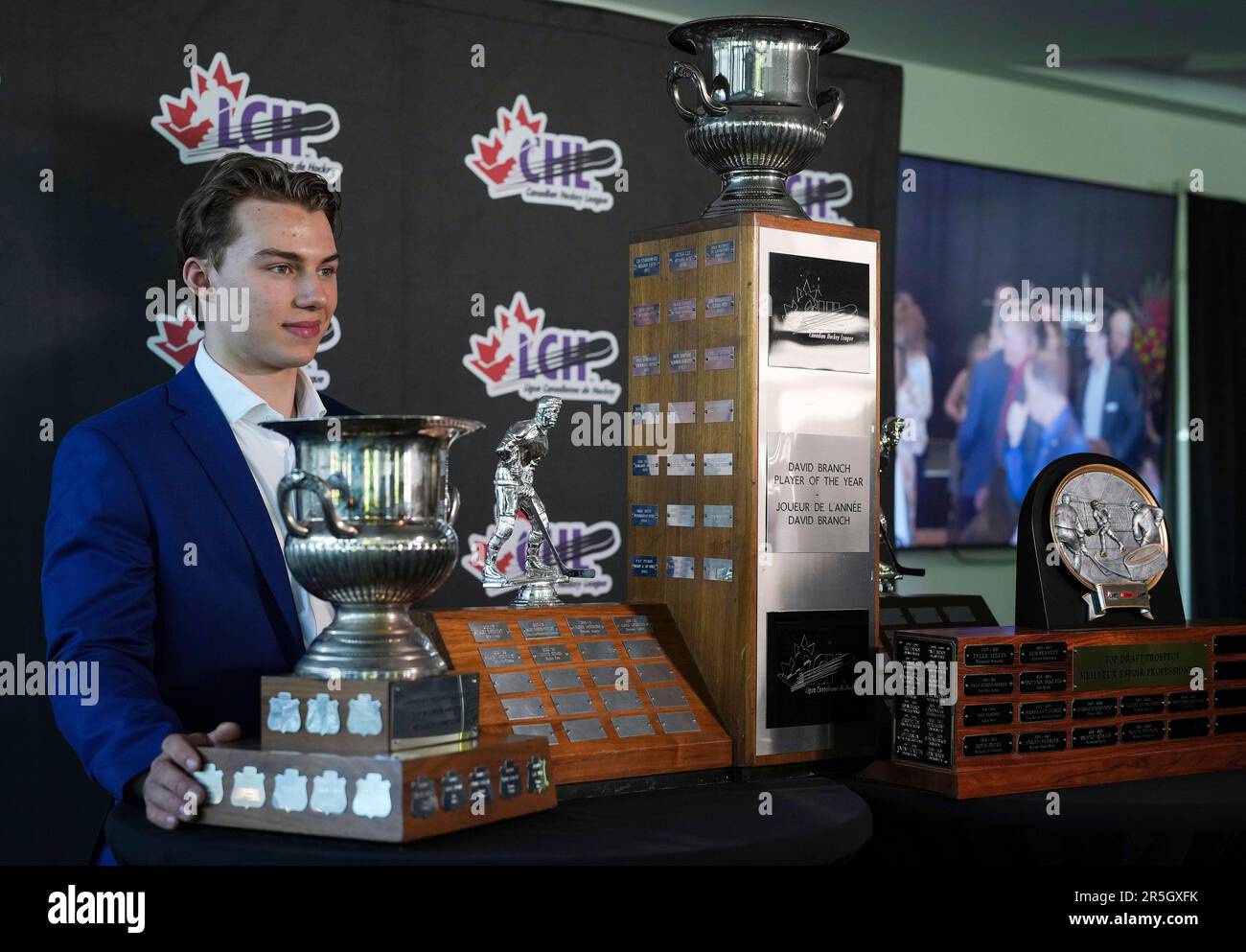 Regina Pats centre Connor Bedard poses for photographs with the trophies he received at the ...