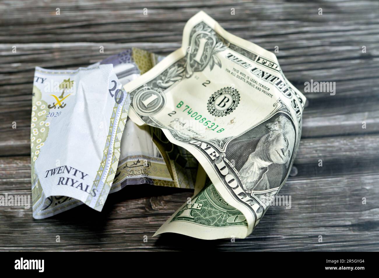Wrinkled and crumpled Saudi Arabia money of 20 SAR twenty riyals and 1 ...