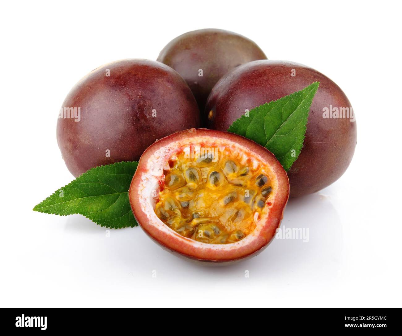 Fresh passion fruit with green leaves isolated on a white background ...