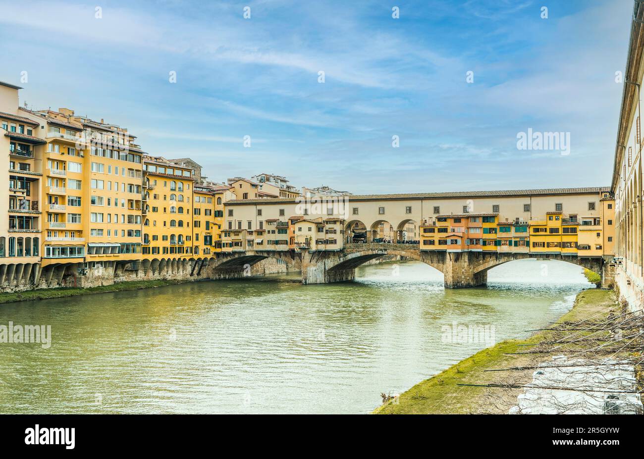 View of the Ponte Vecchio, a medievalstone closed-spandrel segmental arch bridge over the Arno ...