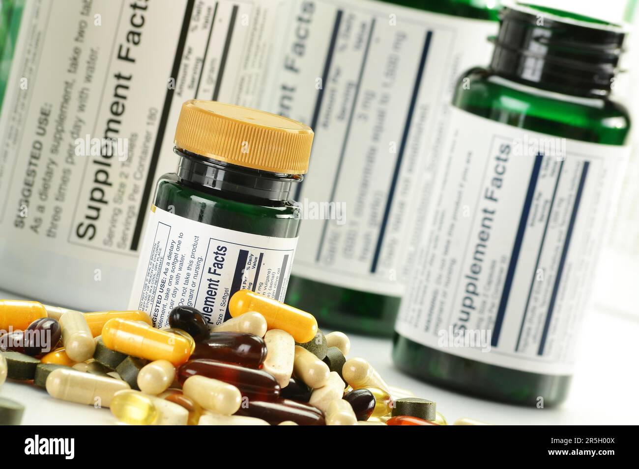 Composition with dietary supplement capsules and containers. Variety of ...