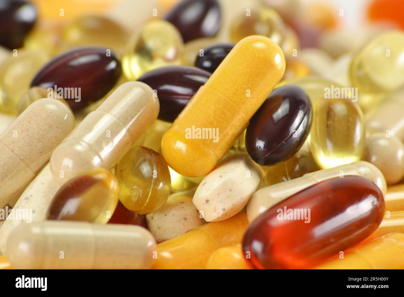 Composition with dietary supplement capsules. Variety of drug pills ...