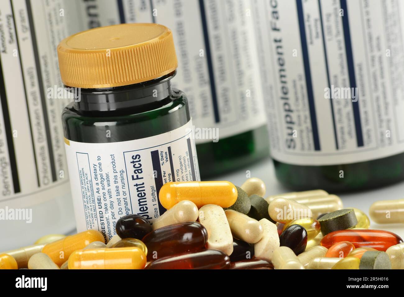Composition with dietary supplement capsules and containers. Variety of ...