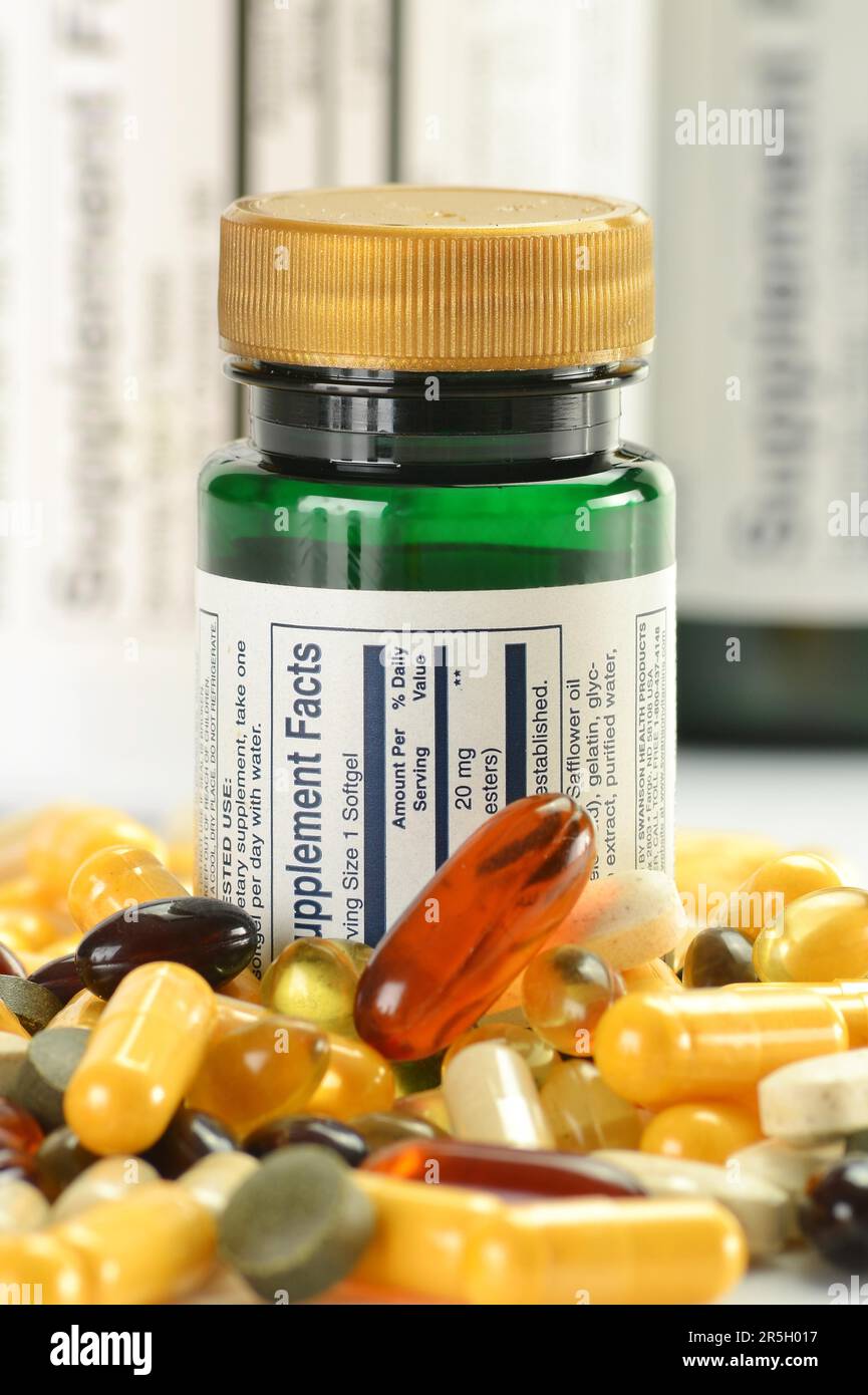 Composition with dietary supplement capsules and containers. Variety of ...