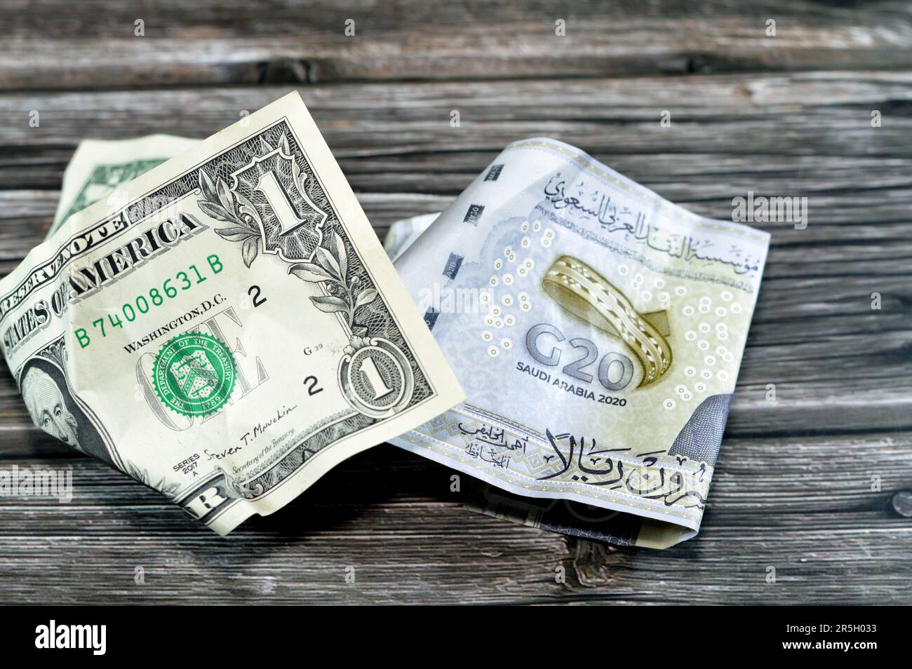 Wrinkled and crumpled Saudi Arabia money of 20 SAR twenty riyals and 1 ...