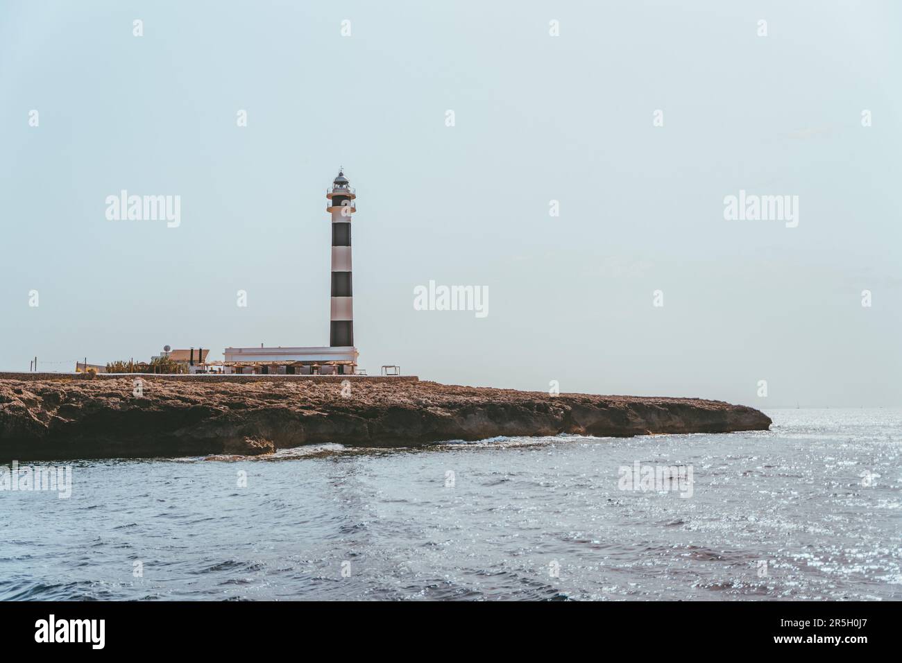Beautiful blue white lighthouse on the Spanish island of Menorca Stock Photo - Alamy