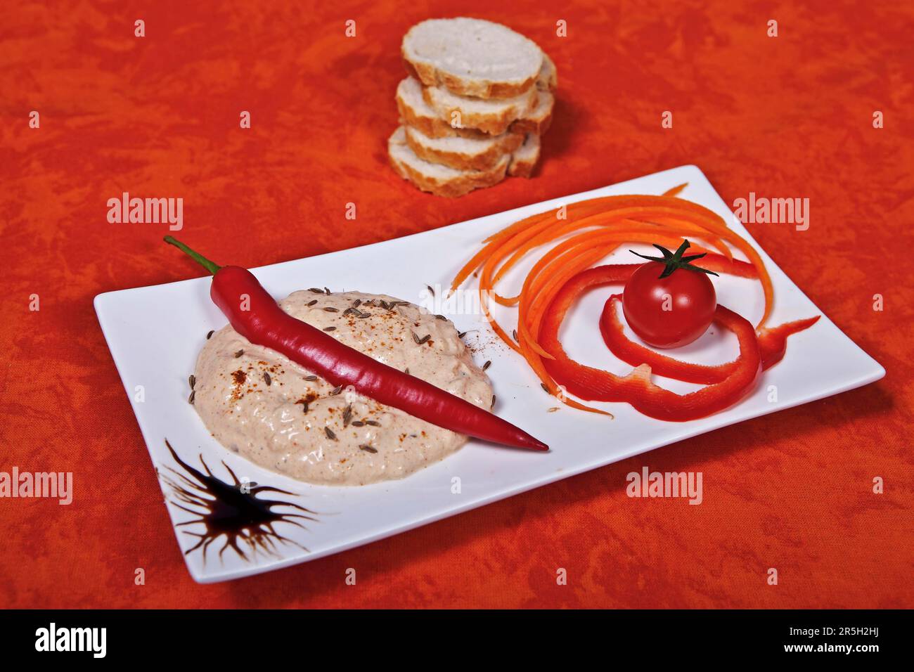 Cream cheese Liptauer, served with raw vegetables, baguette, slices of ...