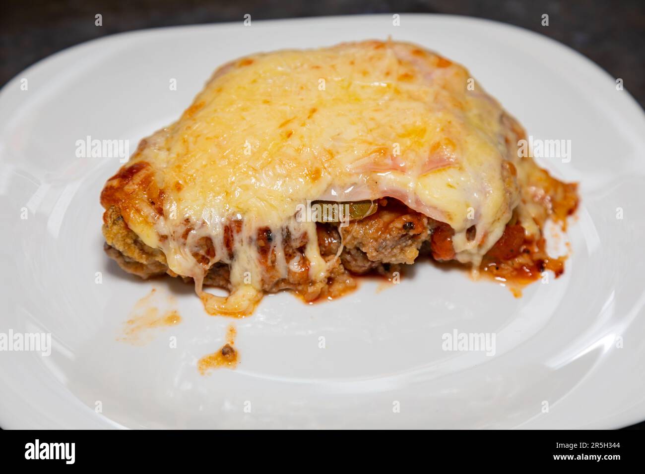 Traditional filet mignon steak parmigiana Stock Photo - Alamy