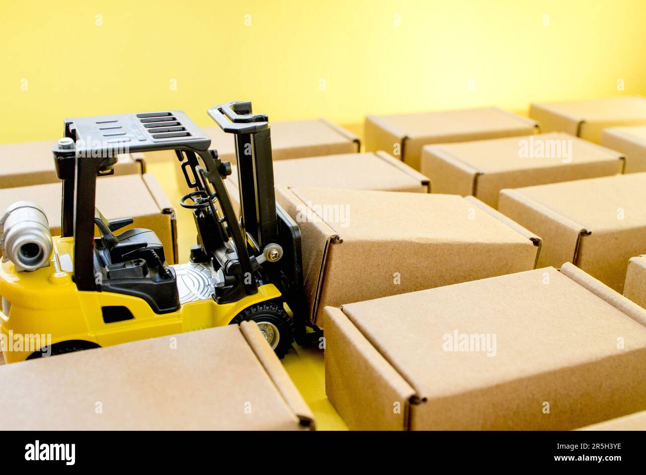 Warehouse with cardboard kraft boxes and a forklift truck. Cargo ...