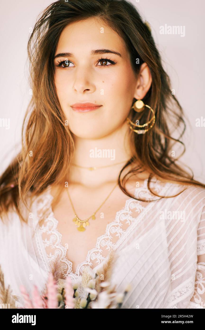 Fashion portrait of pretty young woman wearing boho style dress ...