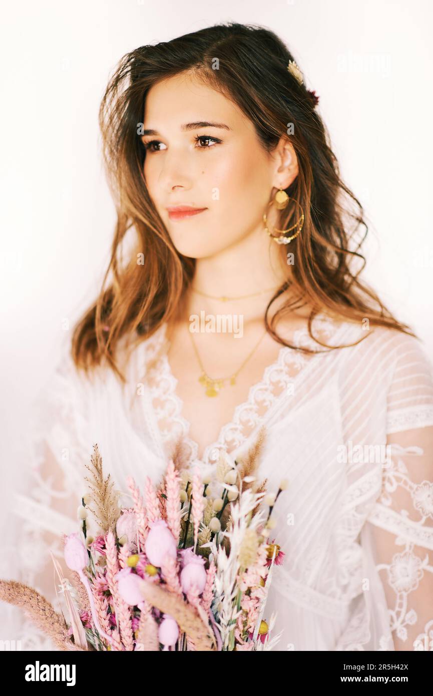 Fashion portrait of pretty young woman wearing boho style dress ...