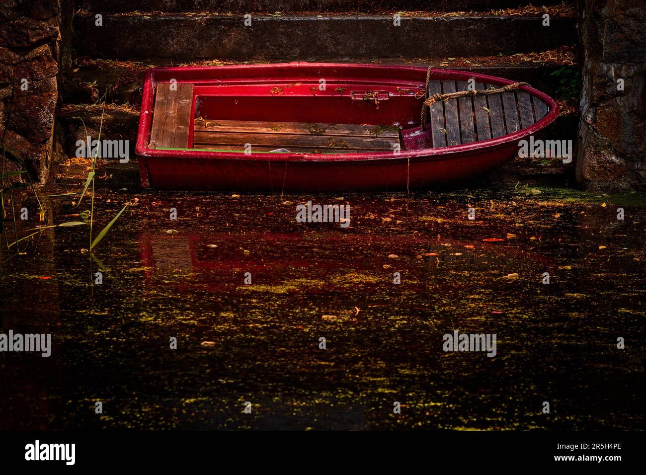 Old red rowing boat with light atmosphere Stock Photo - Alamy