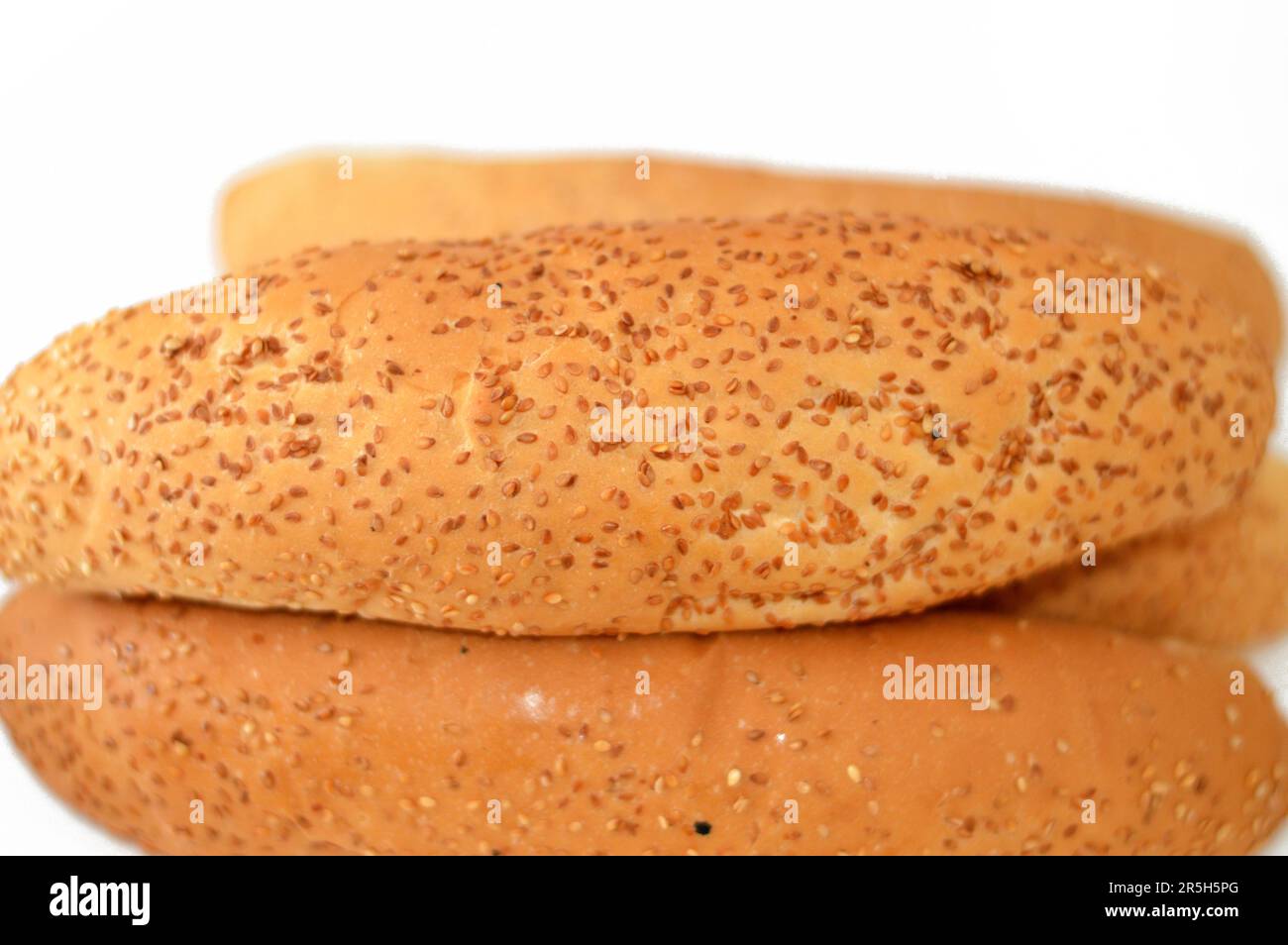 Long sesame bun bread, a fresh baked loaf of bread French Fino ready to ...