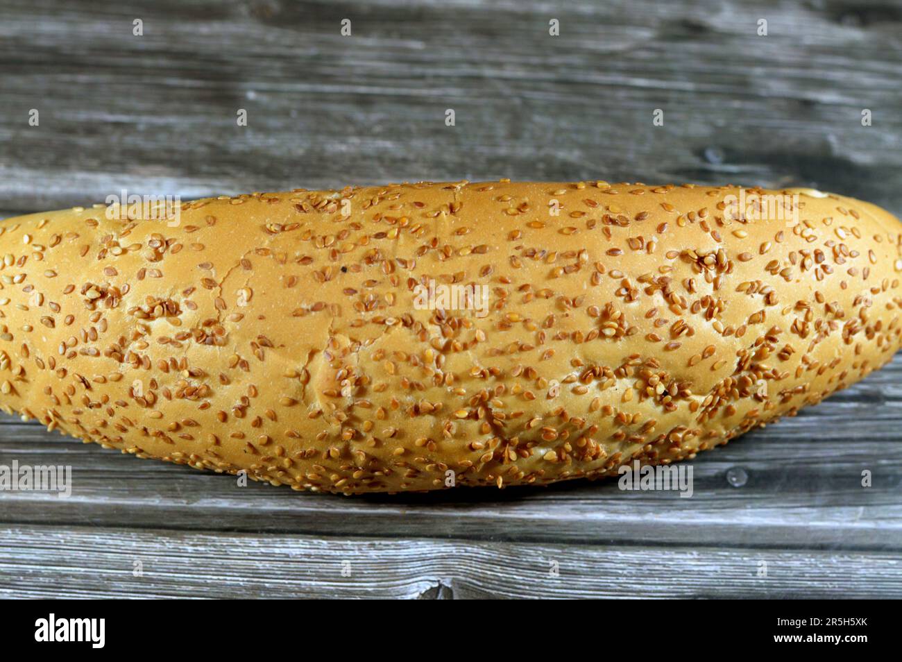 Long sesame bun bread, a fresh baked loaf of bread French Fino ready to ...