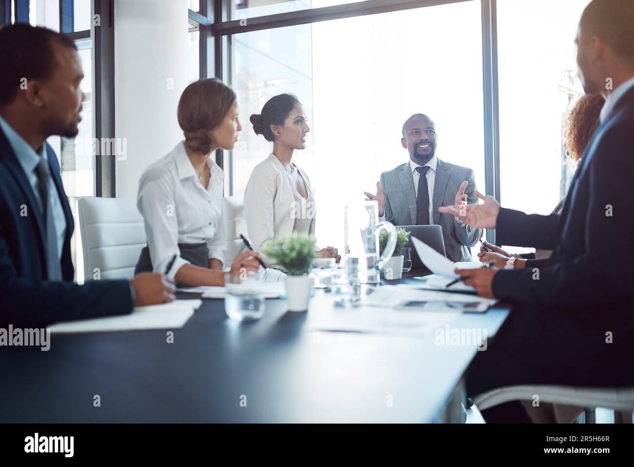 His meetings keep everyone engaged. a team of professionals having a ...