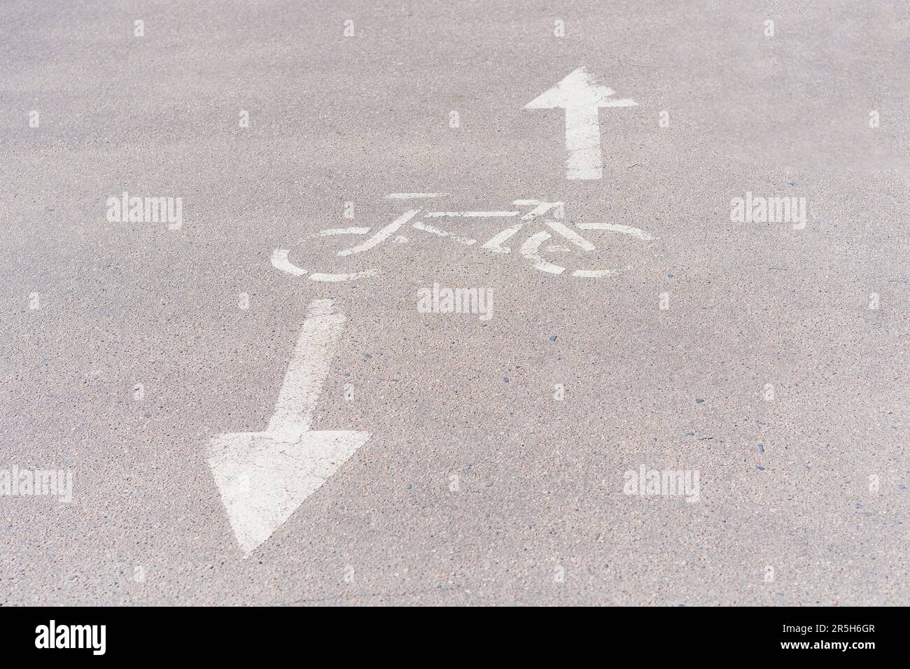 This photo features a detailed close-up of a bicycle sign painted on ...