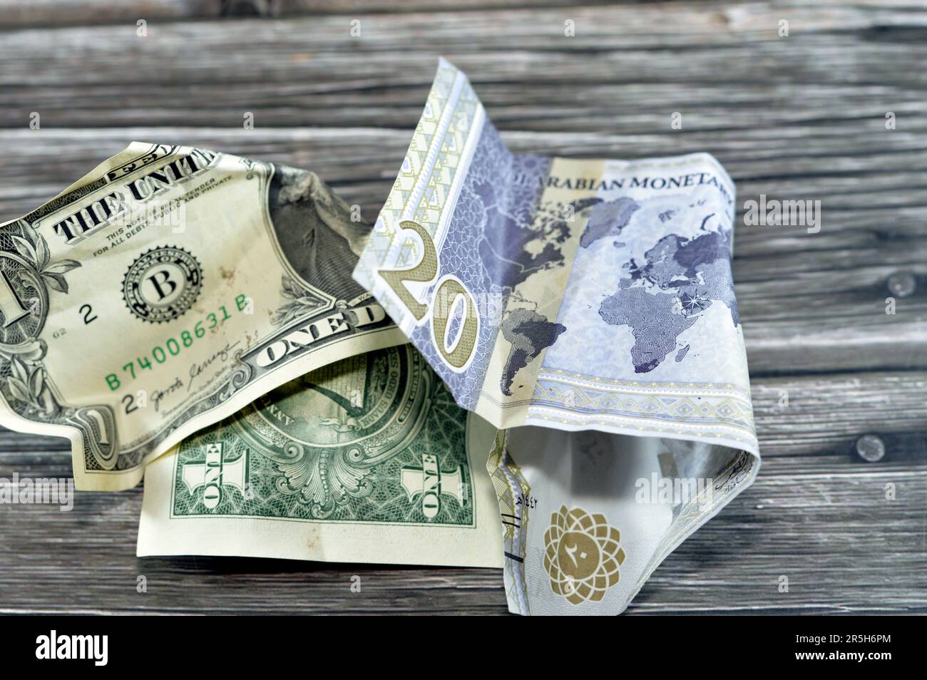 Wrinkled and crumpled Saudi Arabia money of 20 SAR twenty riyals and 1 ...