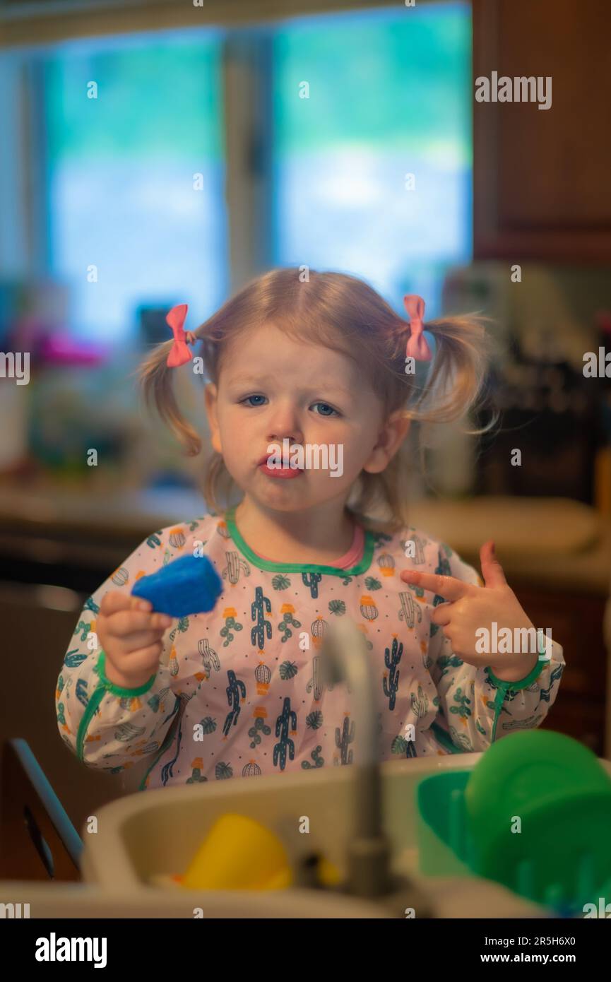 Toddler with a book Stock Photo - Alamy