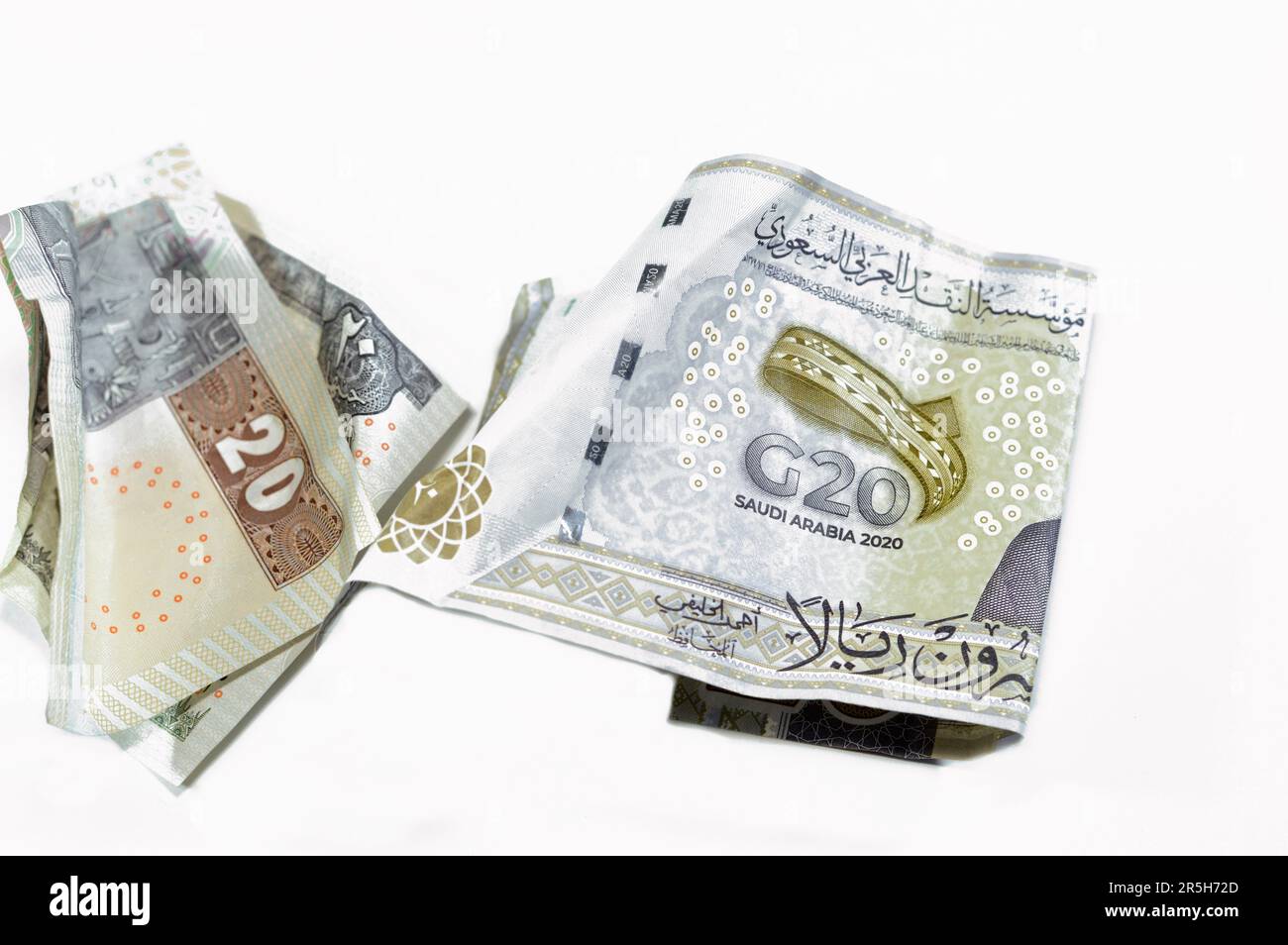 Crumpled Egyptian 20LE twenty pounds and Saudi Arabia money of 20 SAR ...